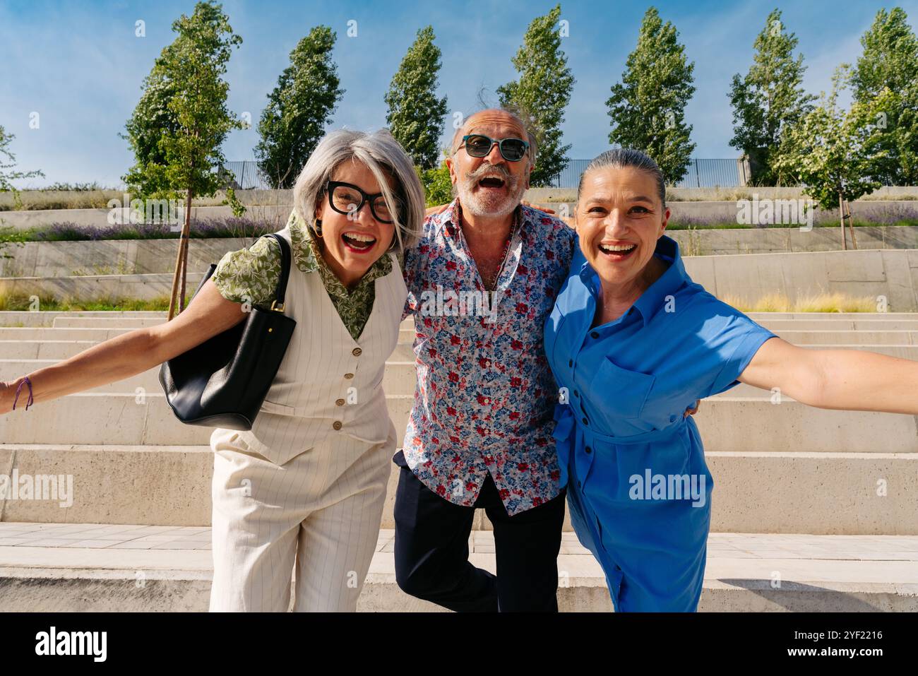 Group of senior friends meeting outdoors in the city and having fun ...