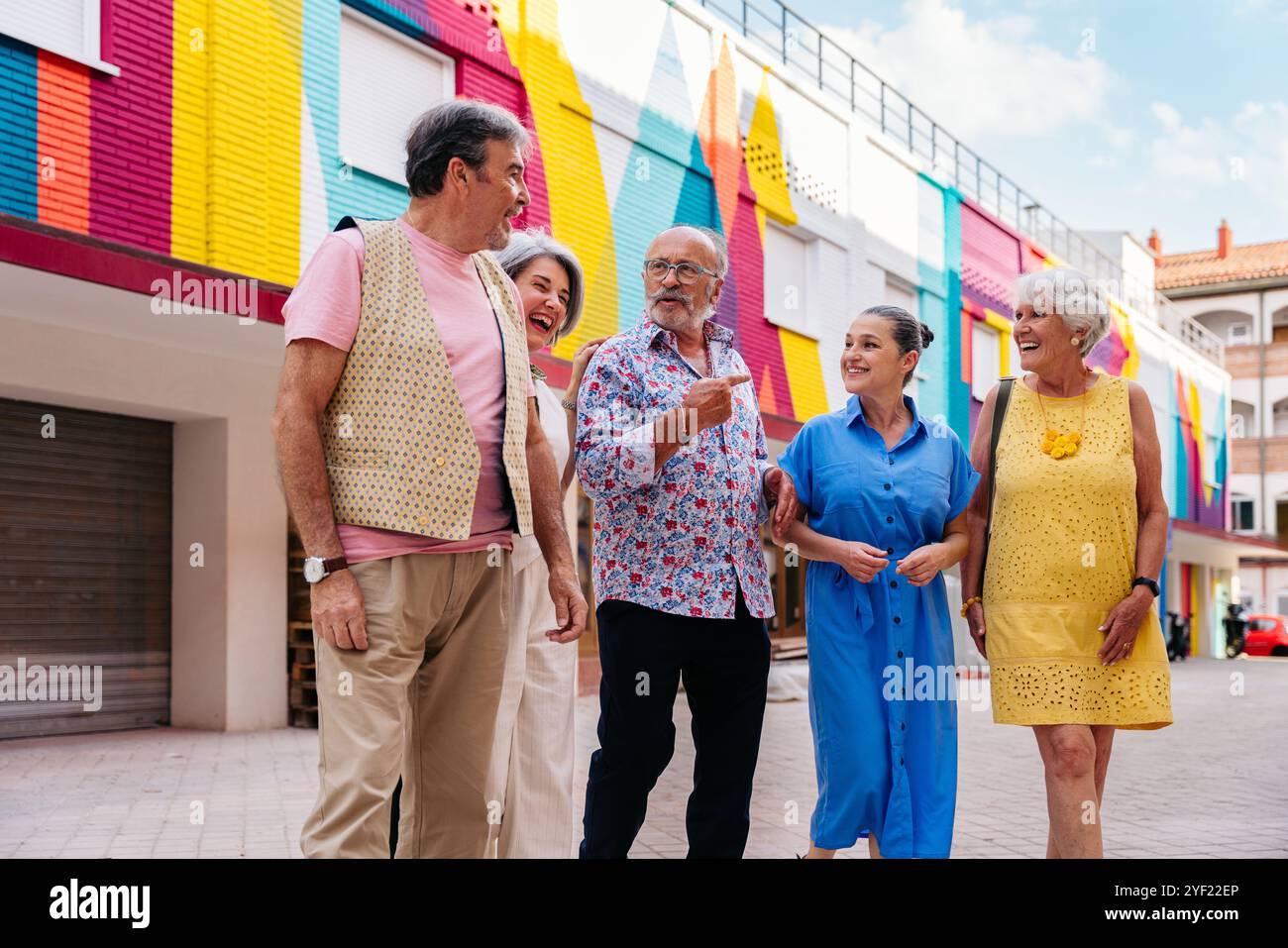 Group of senior friends meeting outdoors in the city and having fun ...