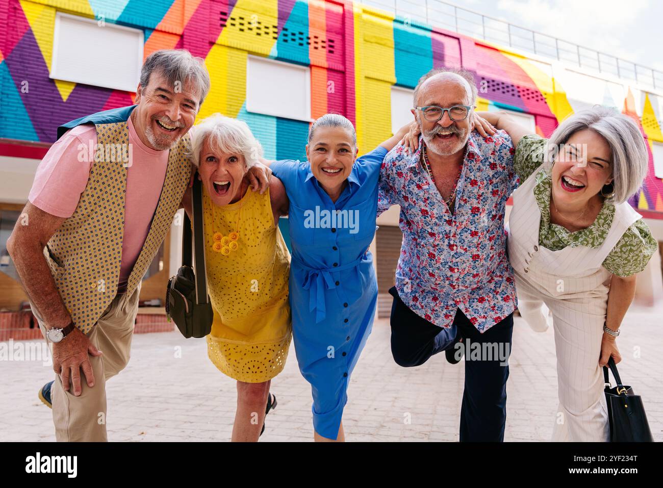 Group of senior friends meeting outdoors in the city and having fun ...