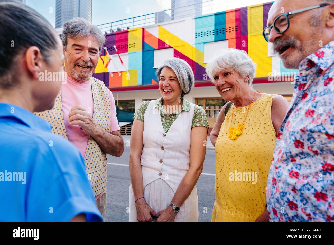 Group of senior friends meeting outdoors in the city and having fun ...