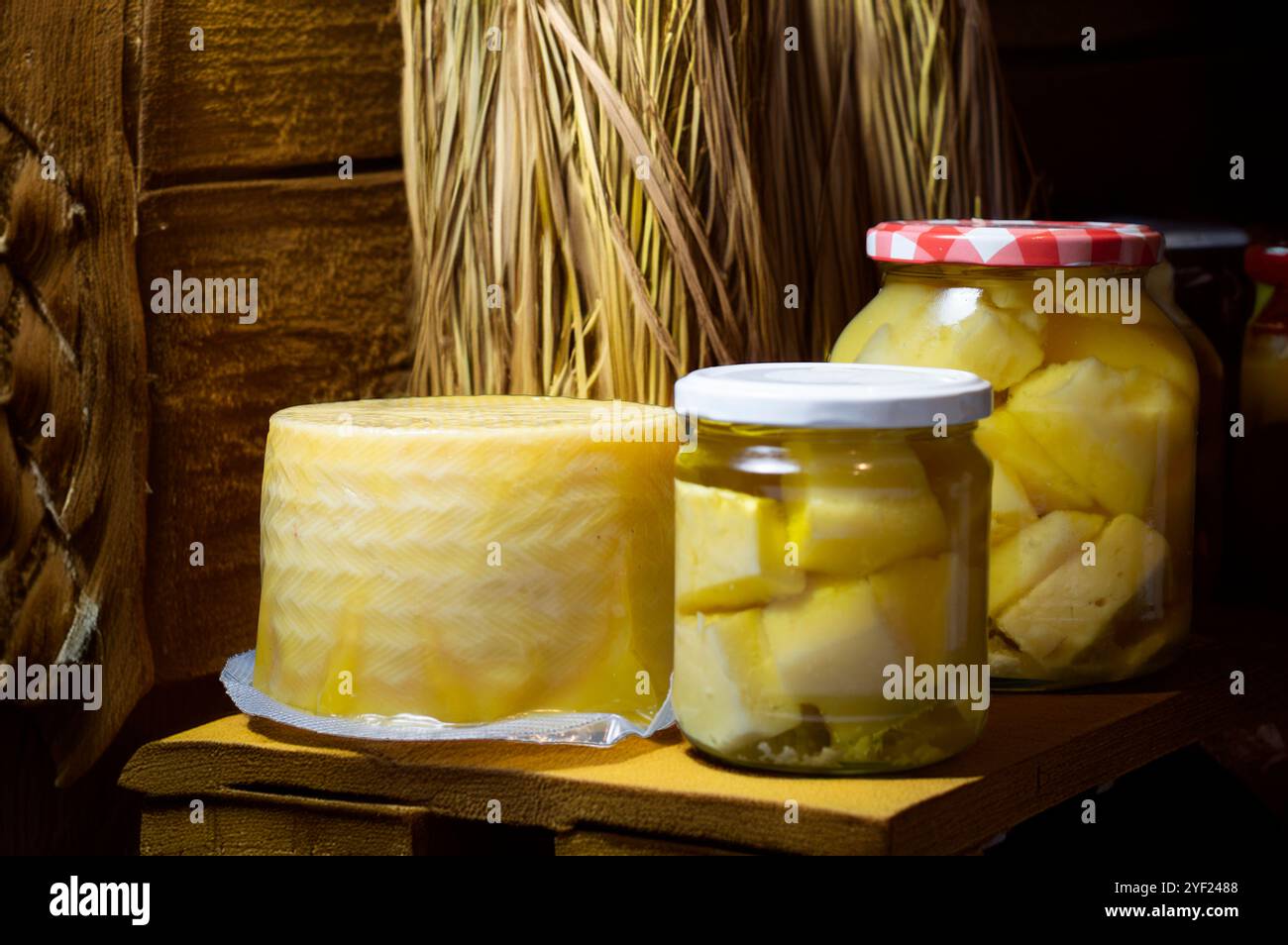Preparation of preserved cheese with oil Stock Photo - Alamy
