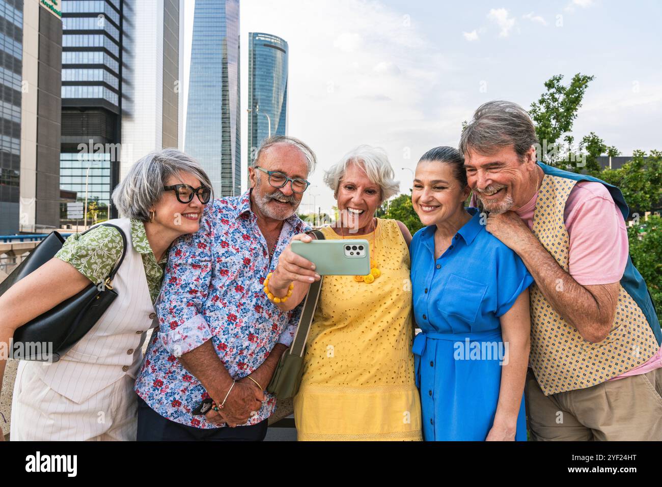Group of senior friends meeting outdoors in the city and having fun ...