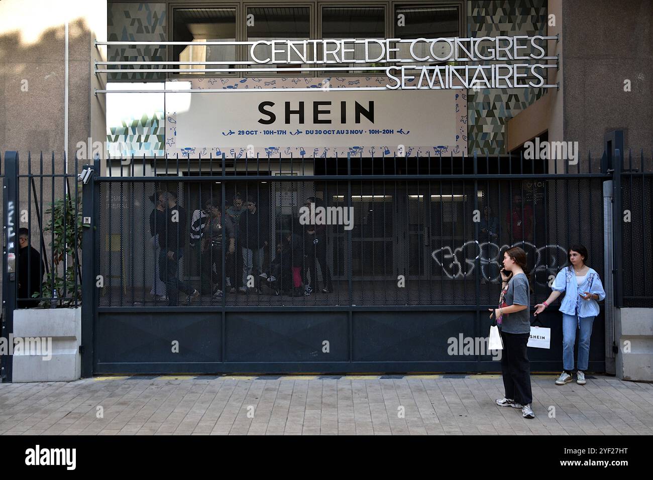 People are seen in front of the pop-up store of Chinese fashion brand ...