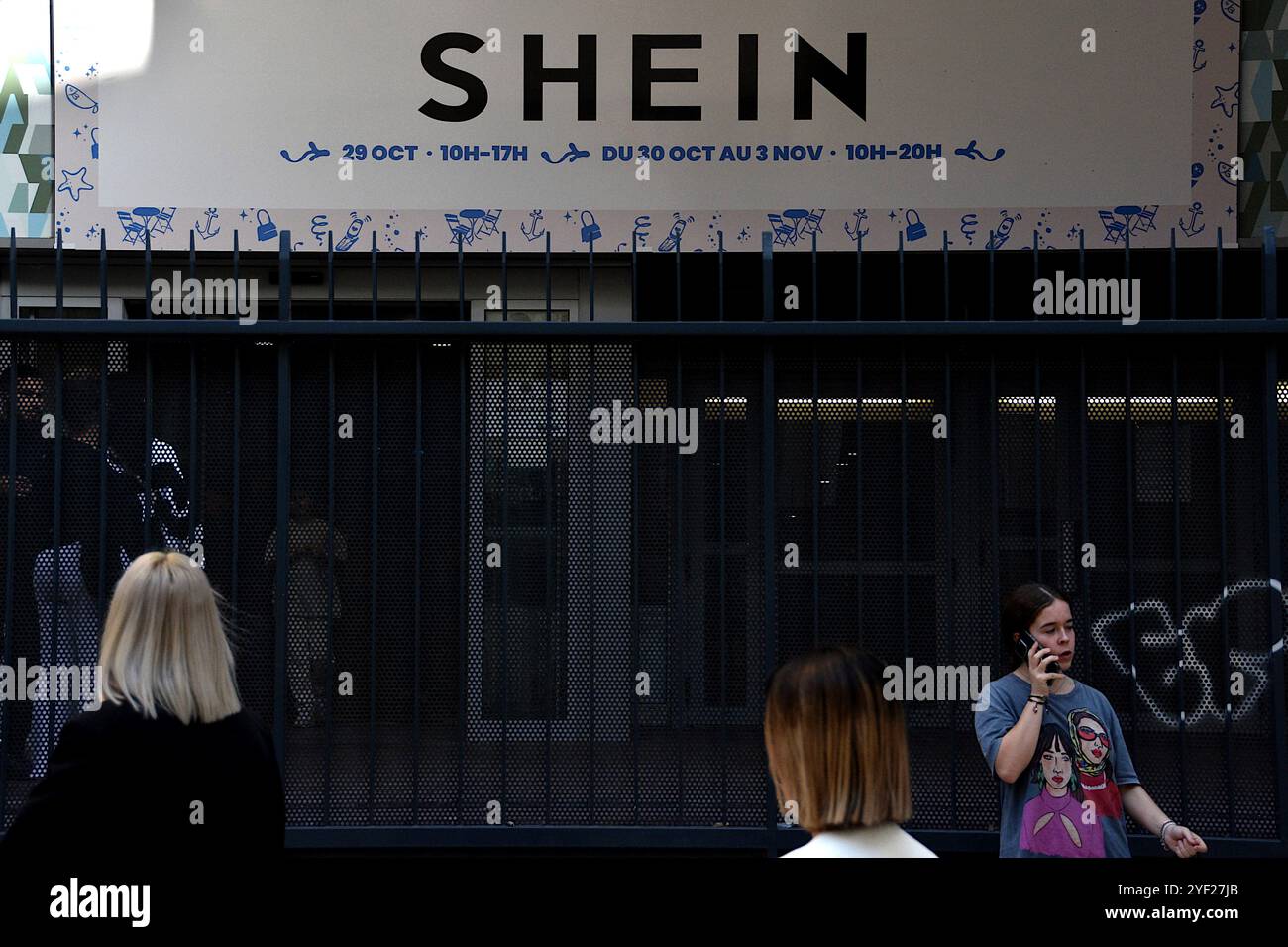 People are seen in front of the pop-up store of Chinese fashion brand ...