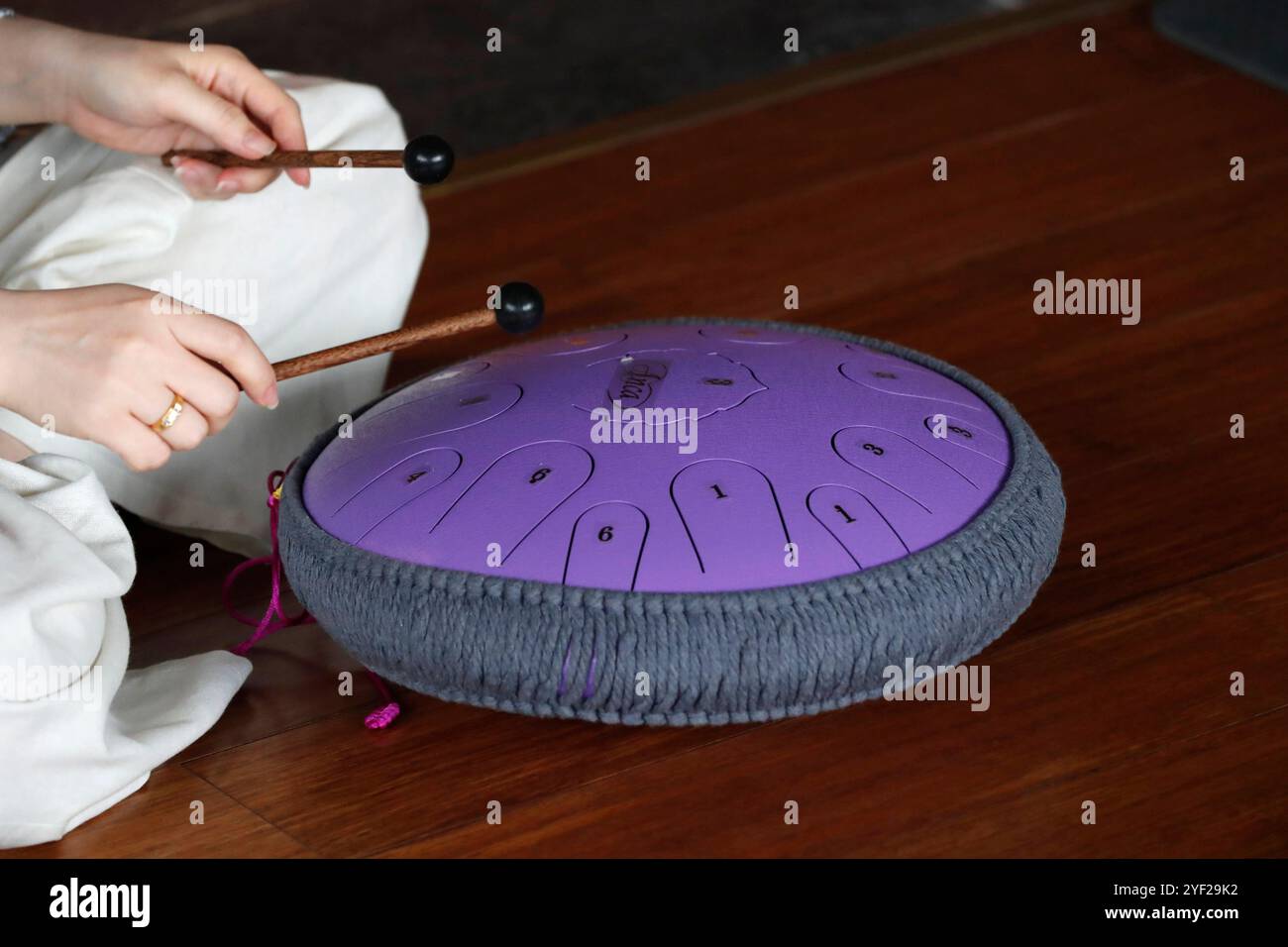 Steel tongue, drum. Singing bowl, steel drum and drumsticks. Instrument ...