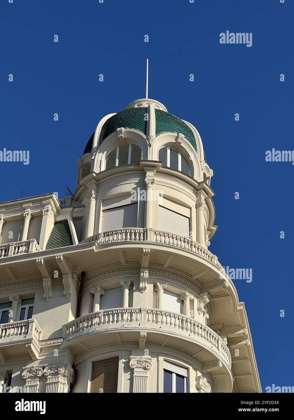 Upper section of a classic European-style building with ornate white ...