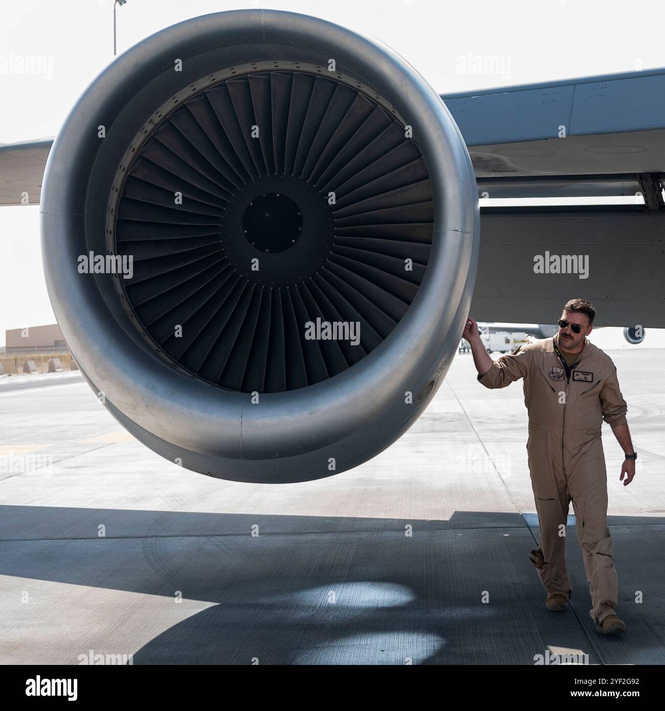 A U.S. Air Force KC-135 Stratotanker pilot examines an engine before a ...