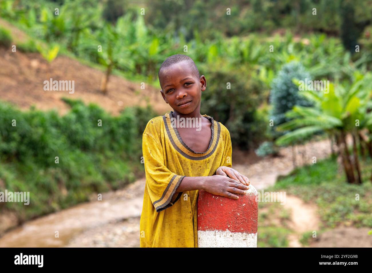 Boy standing near a river in western Rwanda Boy standing near a river ...