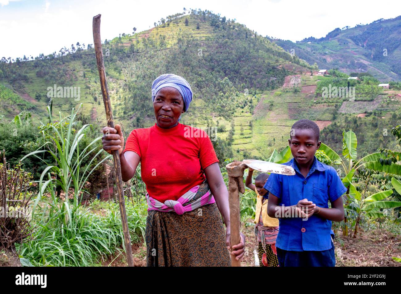 Mother and children in a Northern Rwanda landscape Mother and children ...