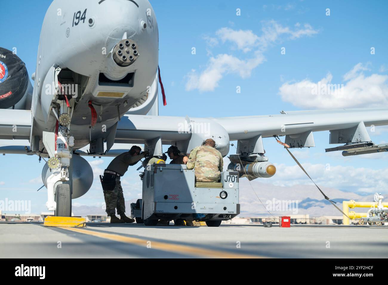 Weapons specialists assigned to the 124th Fighter Wing load MK-82 ...