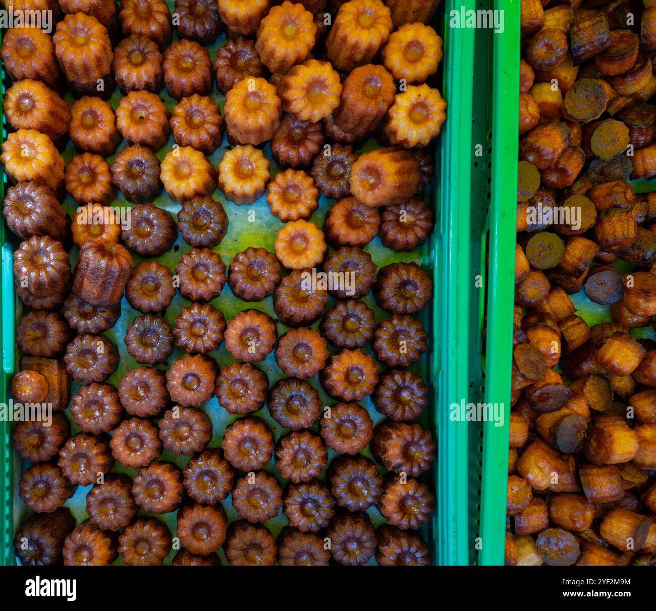 Baked Canele, French pastry flavored with rum and vanilla, specialty of ...