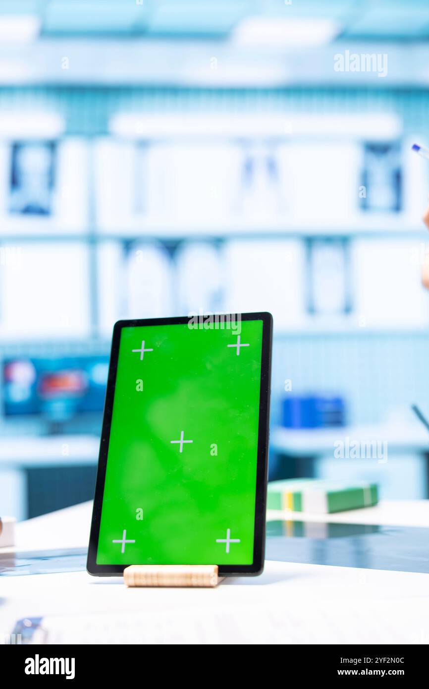 Doctor consulting a male patient in medical facility next to green ...