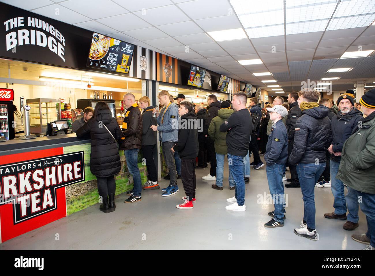 Supporters on the concourse purchasing food before kick-off at Hull ...