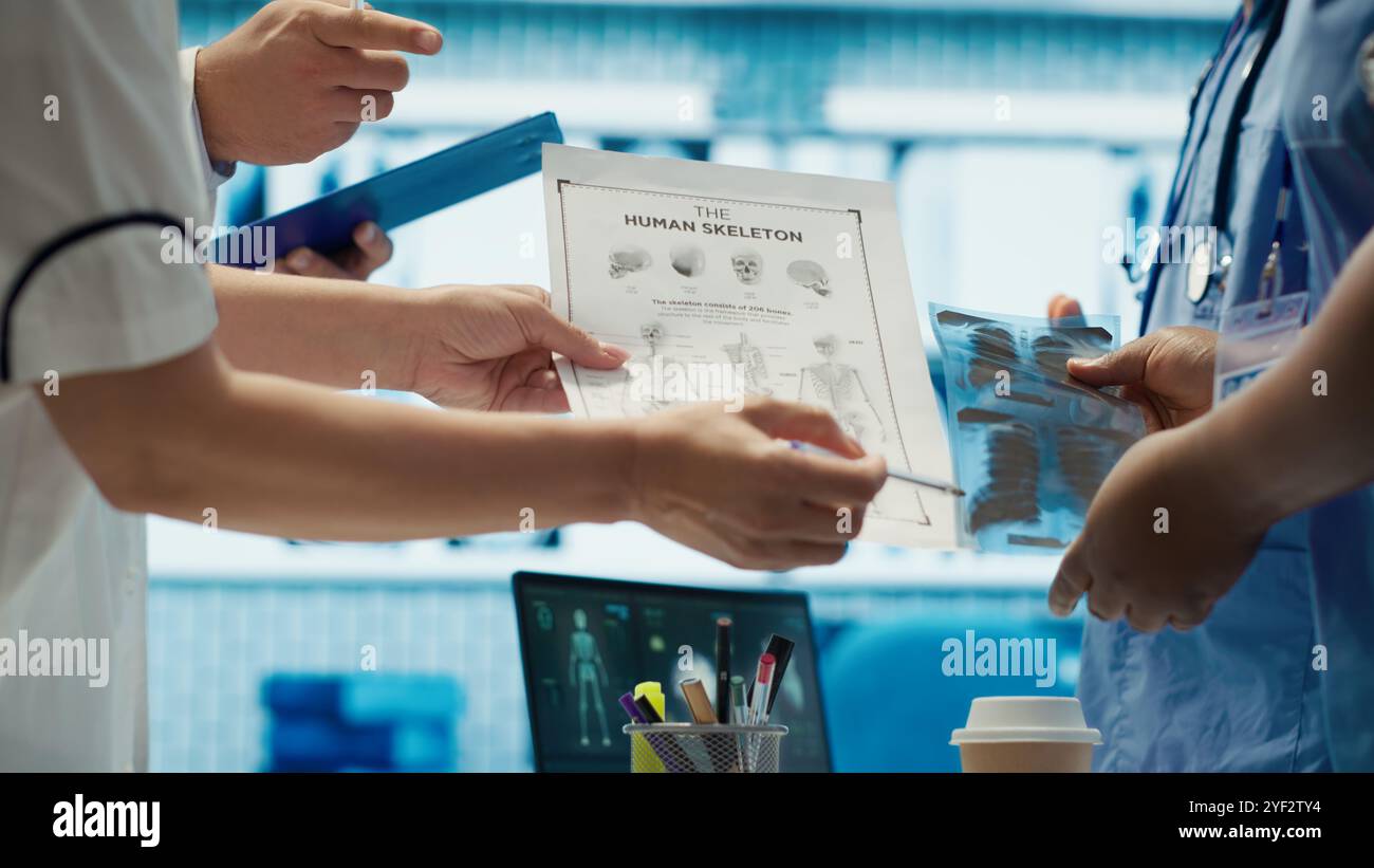 Healthcare team discusses human anatomy and diagnostic strategies in a ...