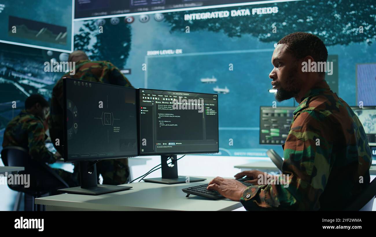 Military specialist in a high tech control center managing satellite ...