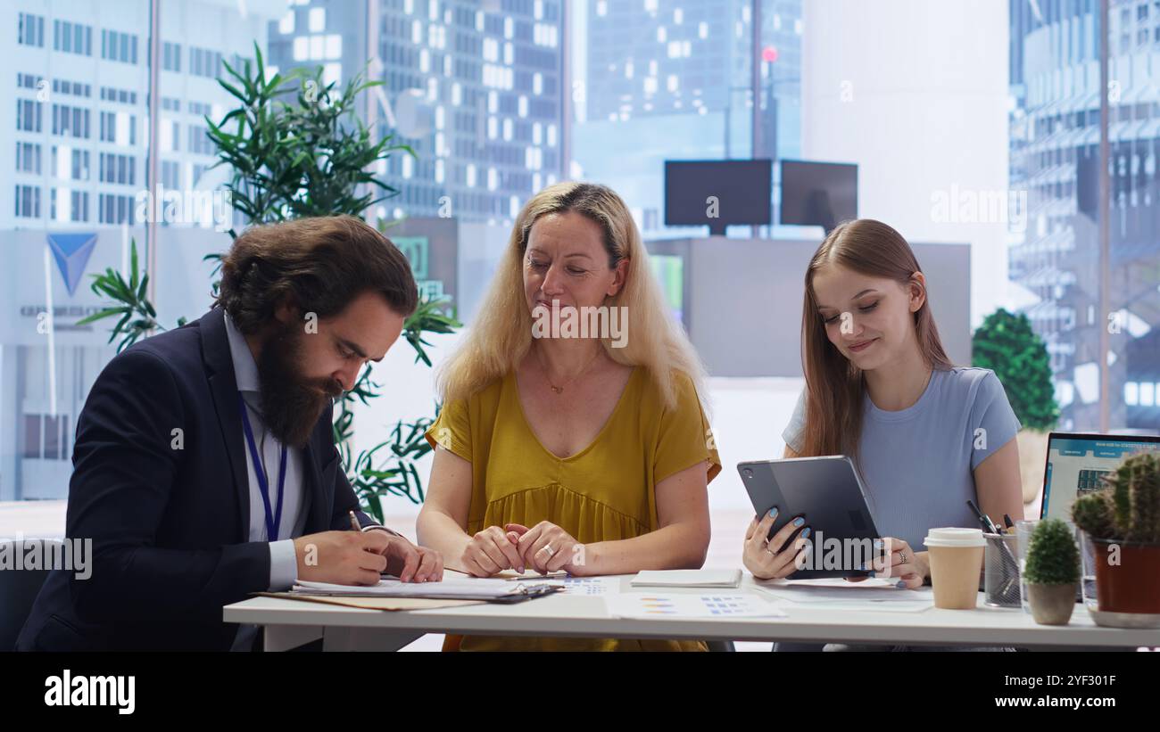 Financial advisor meeting with family members to counsel them on their ...