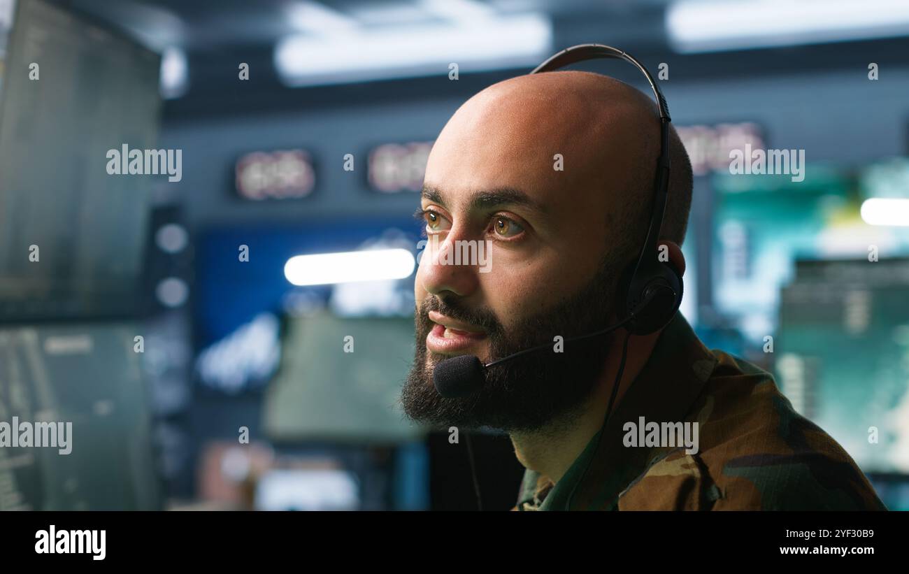 Middle Eastern military dispatcher relays info from army intelligence analysts to troops on ...