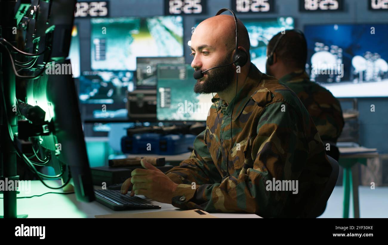 Soldier solving tasks in military HQ base, gathering information on enemy troops. Middle Eastern ...