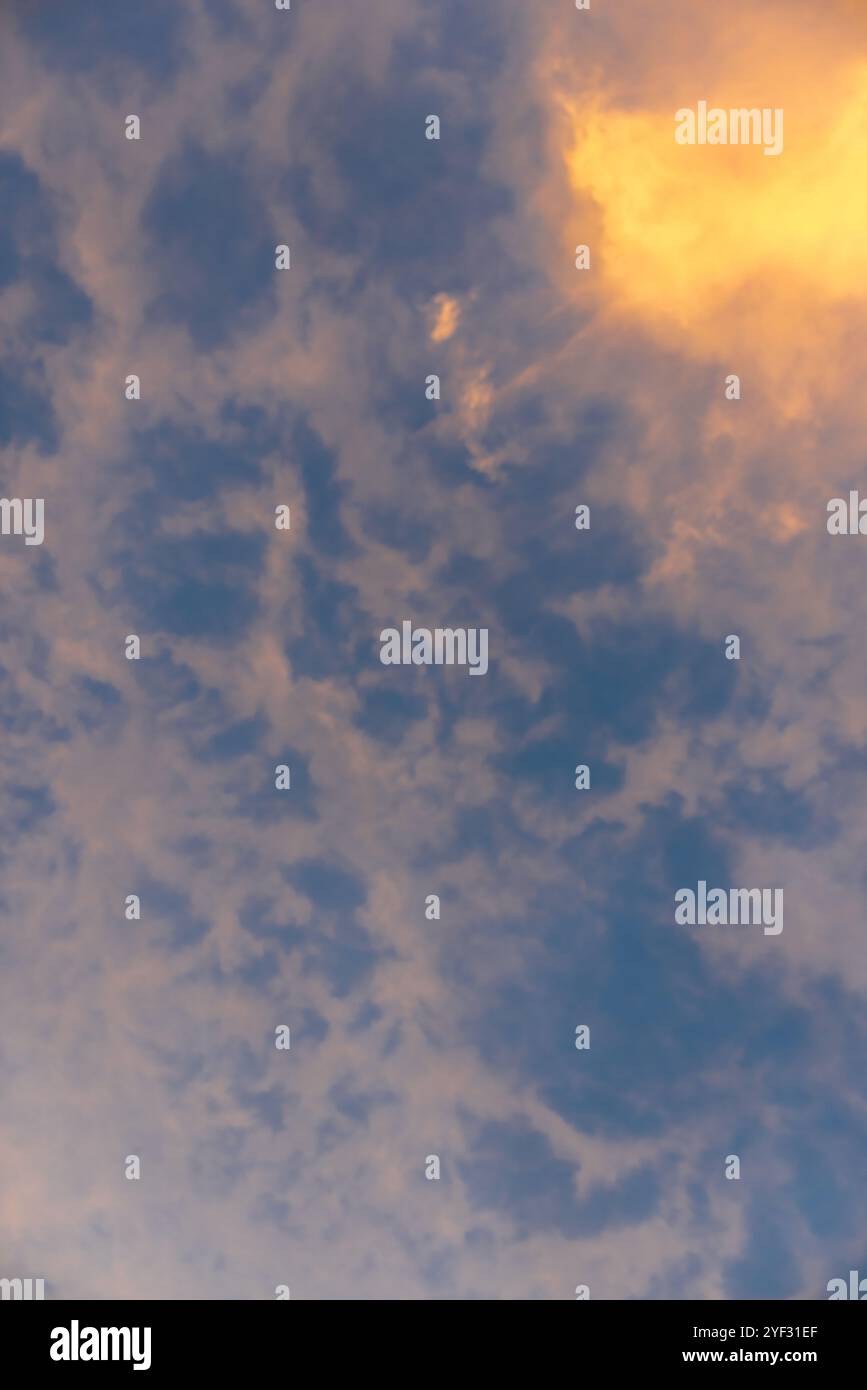 Altocumulus clouds on blue sky and sun at sunset. Background Stock ...