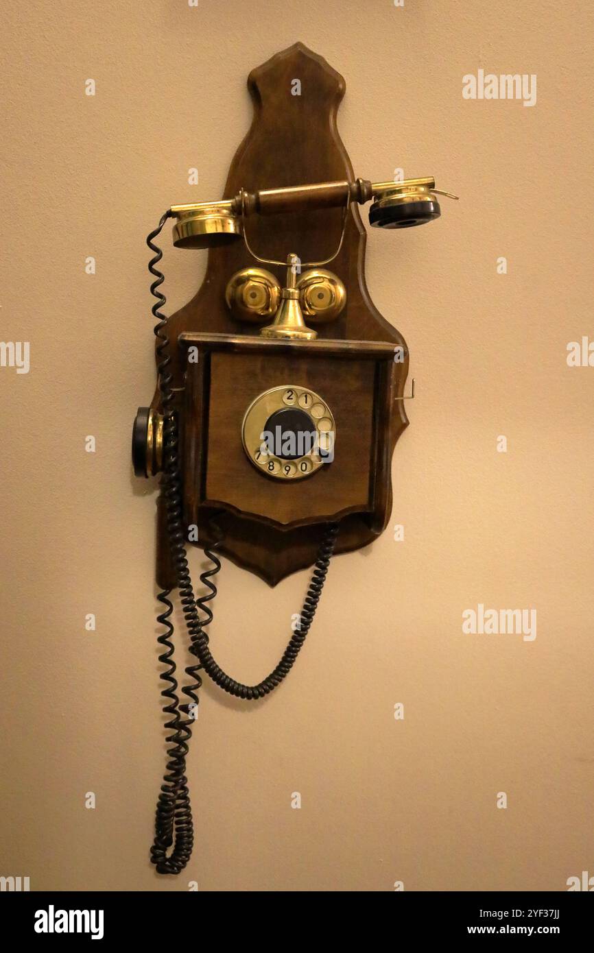 Vintage, retro, antique wooden old dial telephone on the wall Vintage ...