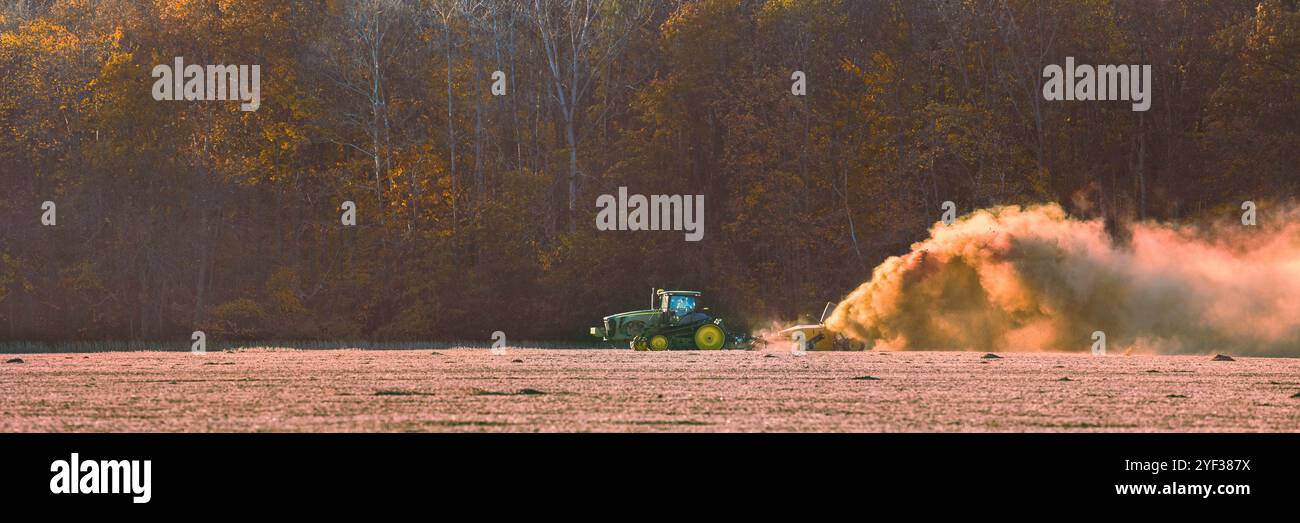 A panorama image of a large tracked tractor pulling a ditching ...