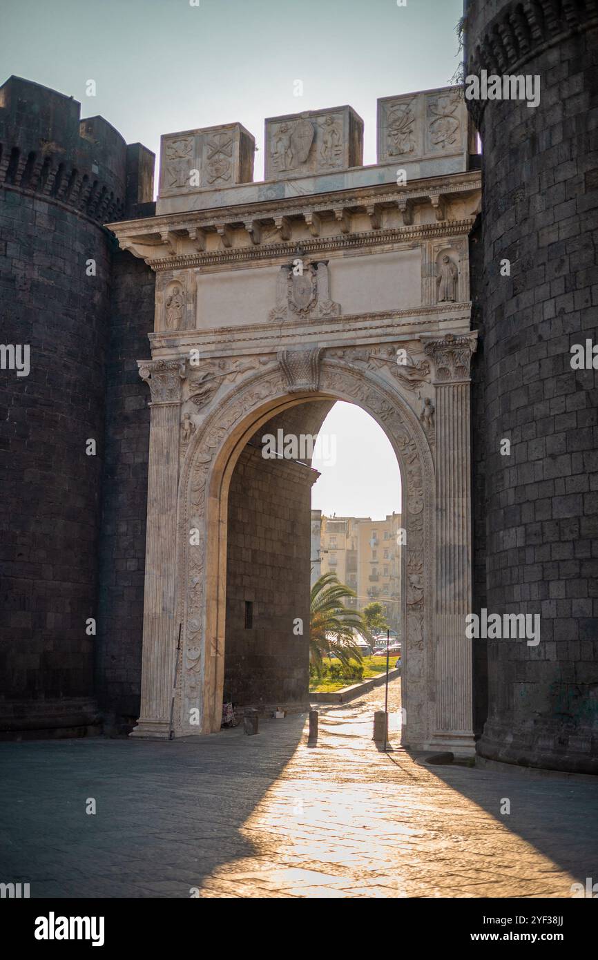 Beautiful evening photo with strong sunshine backlight of Porta Capuana ...