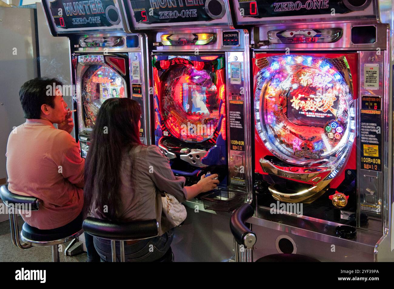 People playing electronic games in a game parlor in Japan Stock Photo ...