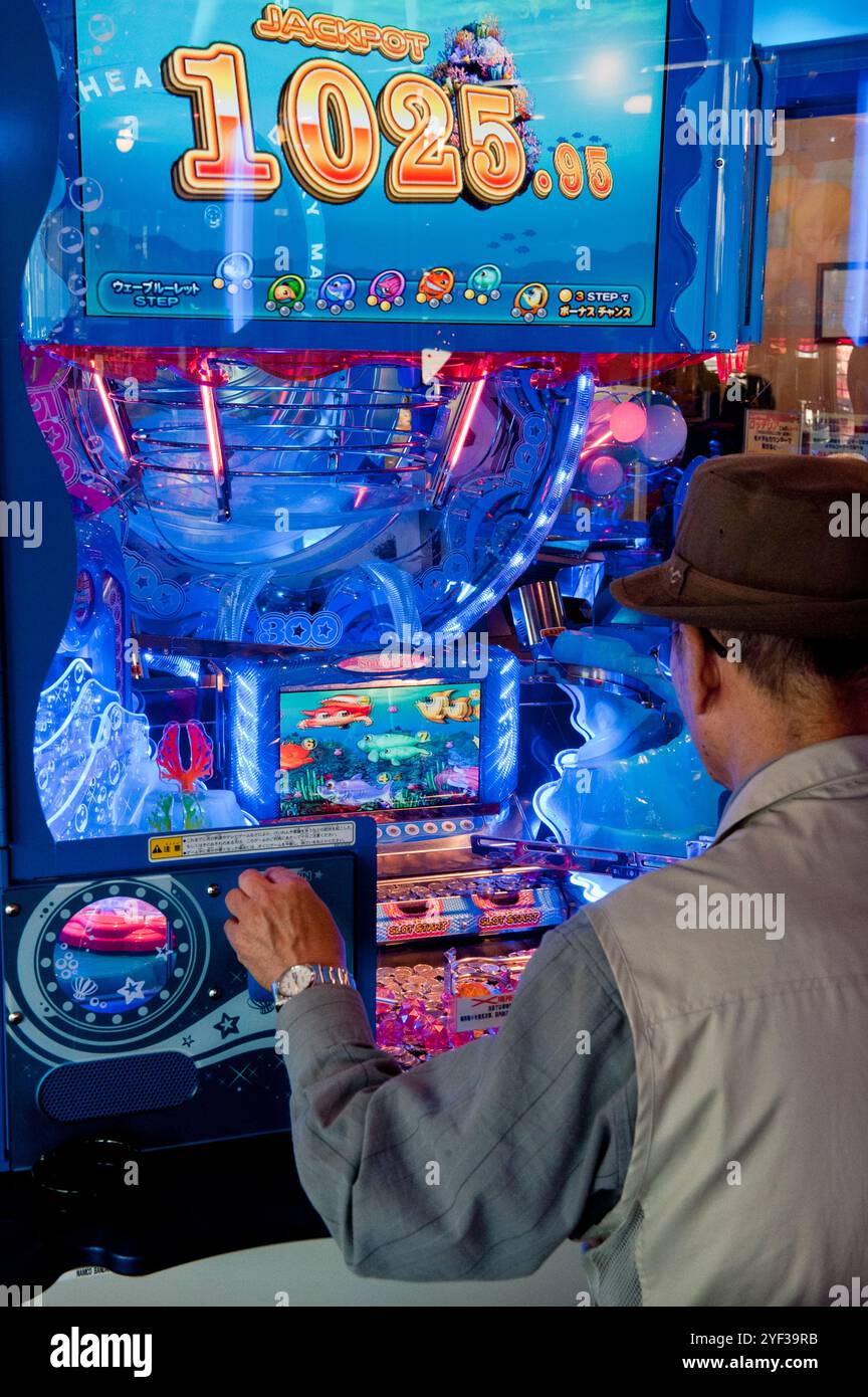 People playing electronic games in a game parlor in Japan Stock Photo ...