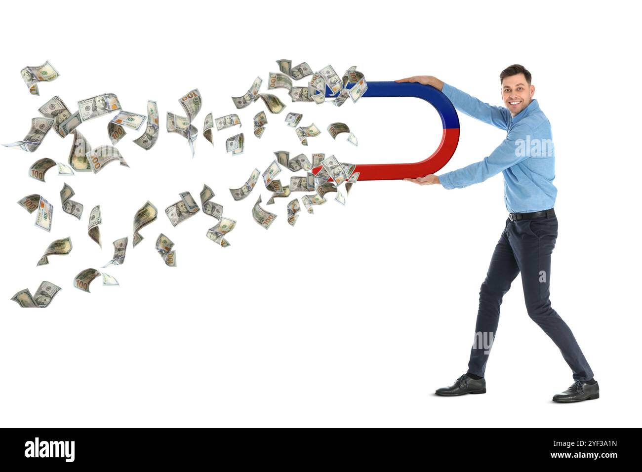 Happy man attracting dollar bills with magnet on white background ...