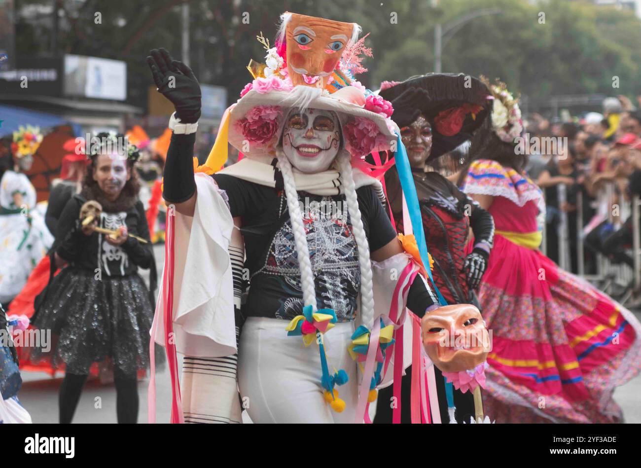 Floats and hundreds of citizens dressed in Day of the Dead-themed ...