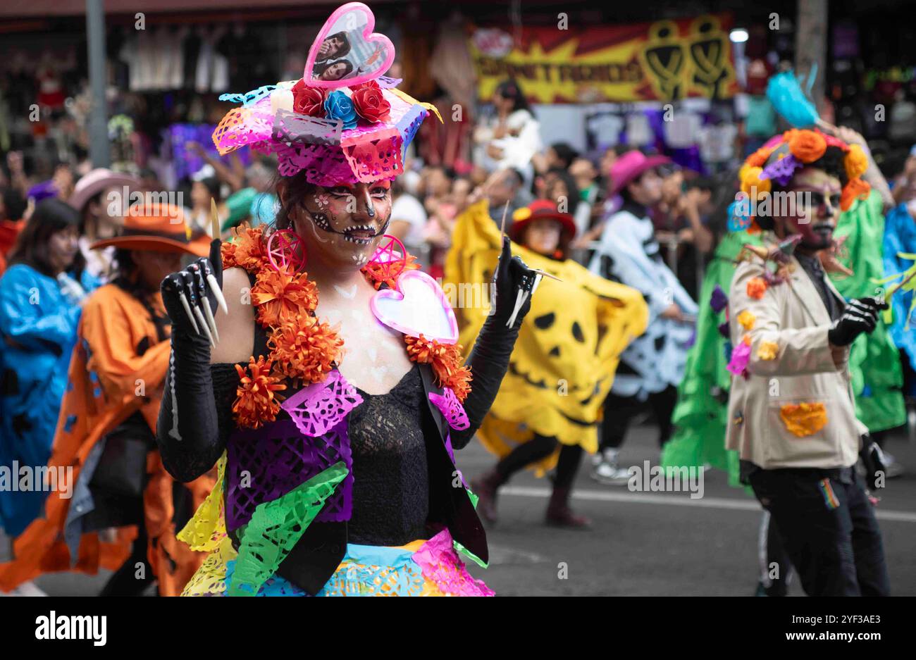 Floats and hundreds of citizens dressed in Day of the Dead-themed ...