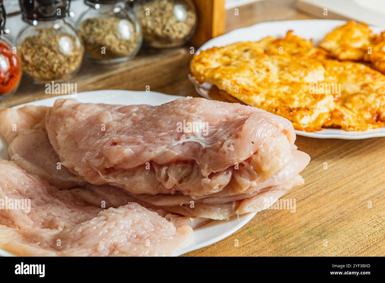 the process of cooking chicken chops with already fried chops in the ...