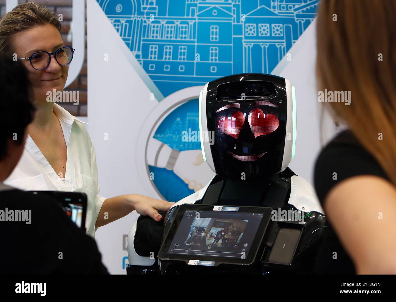 Visitors interact humanoid robot hi-res stock photography and images ...
