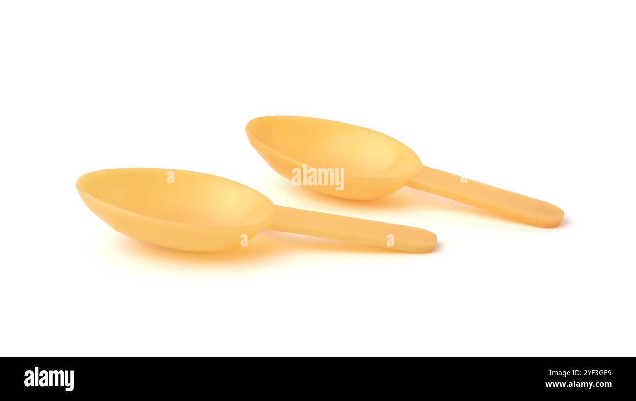 two small plastic spoons isolated white background, food grade for ...