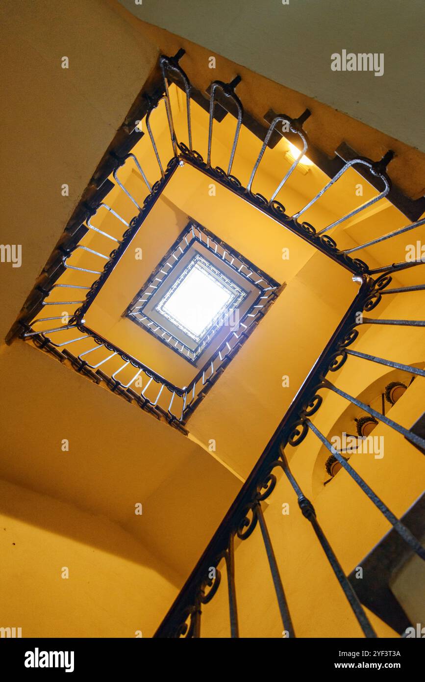 Bottom view of square staircase in old house, Italy Stock Photo - Alamy