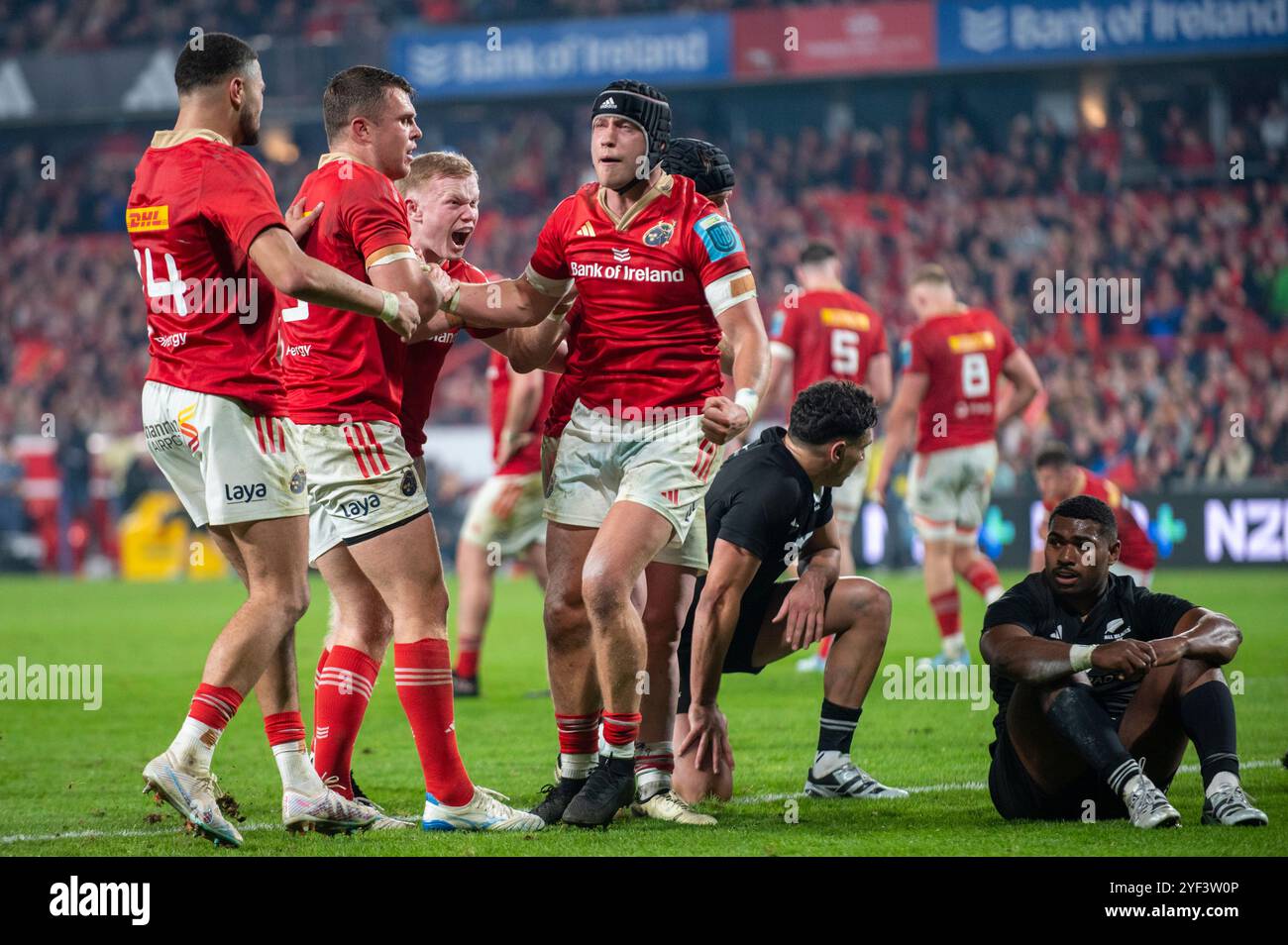 Mike Haley of Munster celebrates scoring with teammates during the test ...