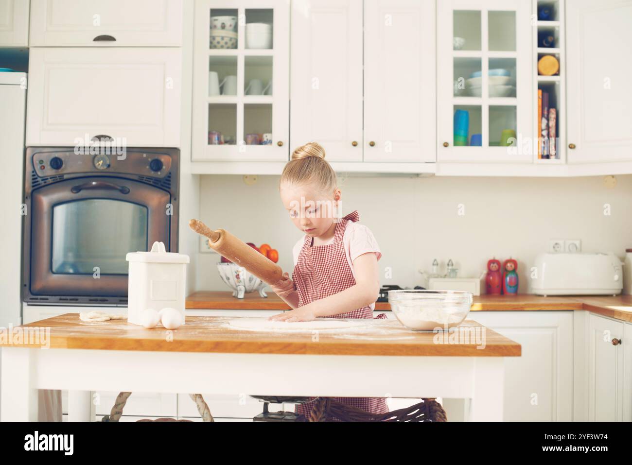 Baking, home and child in kitchen with dough for learning to bake cake ...