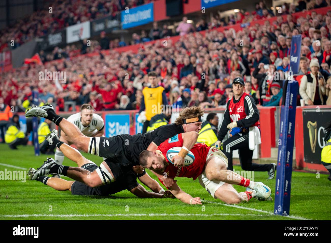 Diarmuid Kilgallen of Munster tackled by Corey Kellow of All Blacks XV ...