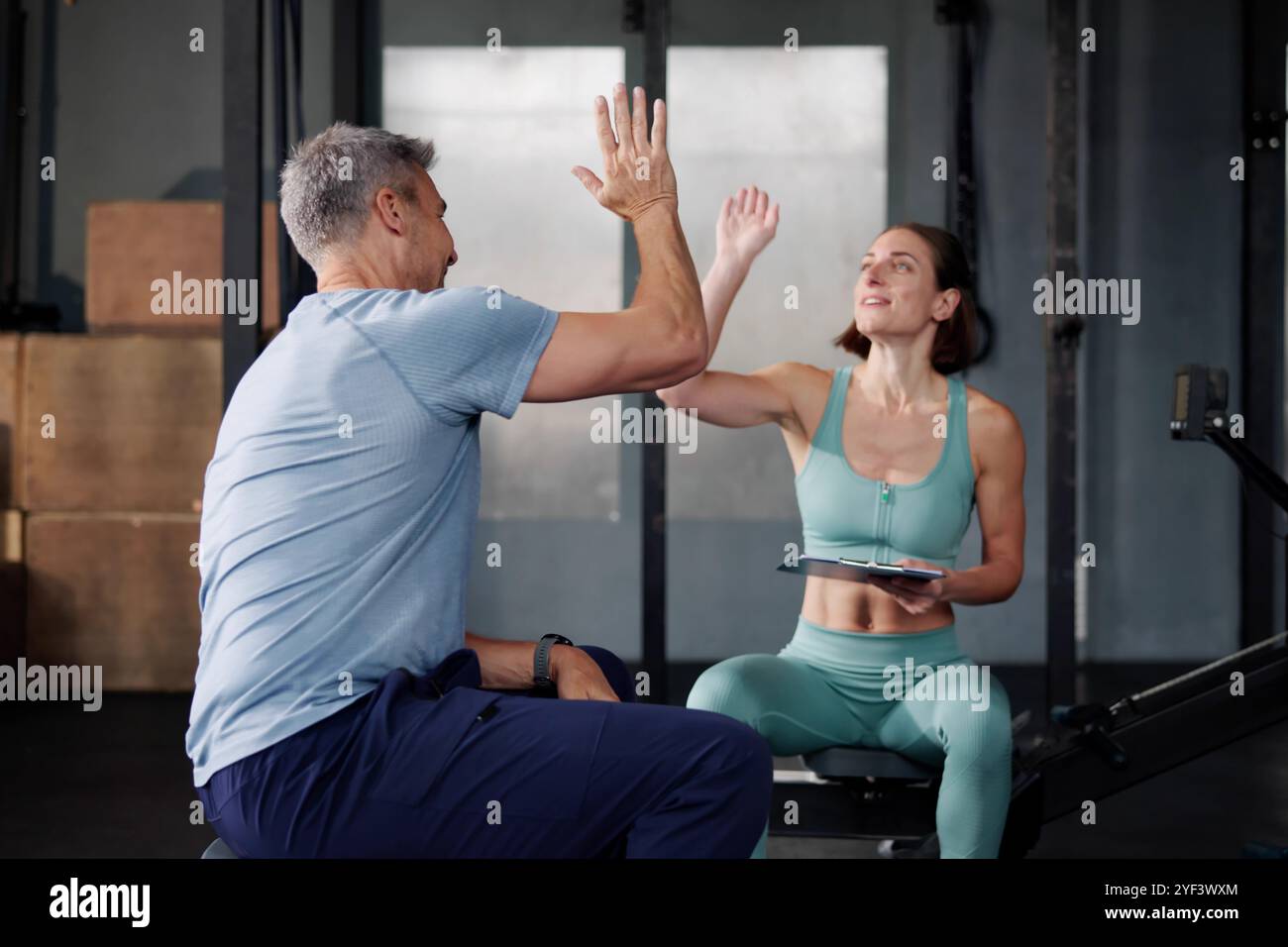 Male personal trainer showing hi-res stock photography and images - Alamy