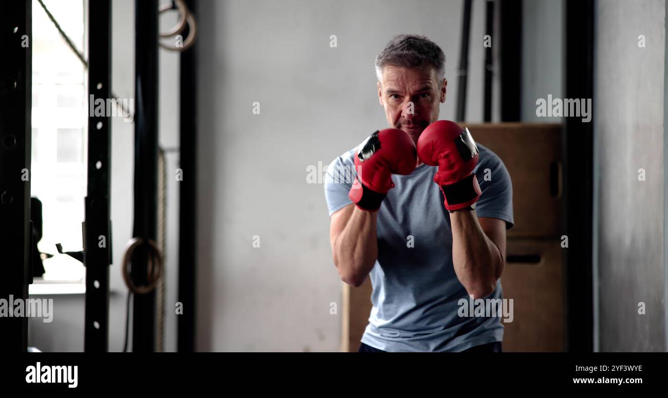 Man Power Boxing In Gym. Doing Kick Training Exercise Stock Photo - Alamy