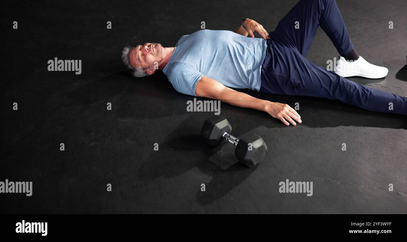 Tired Fit Man After Gym Training Workout. Athlete Lying Down Stock ...