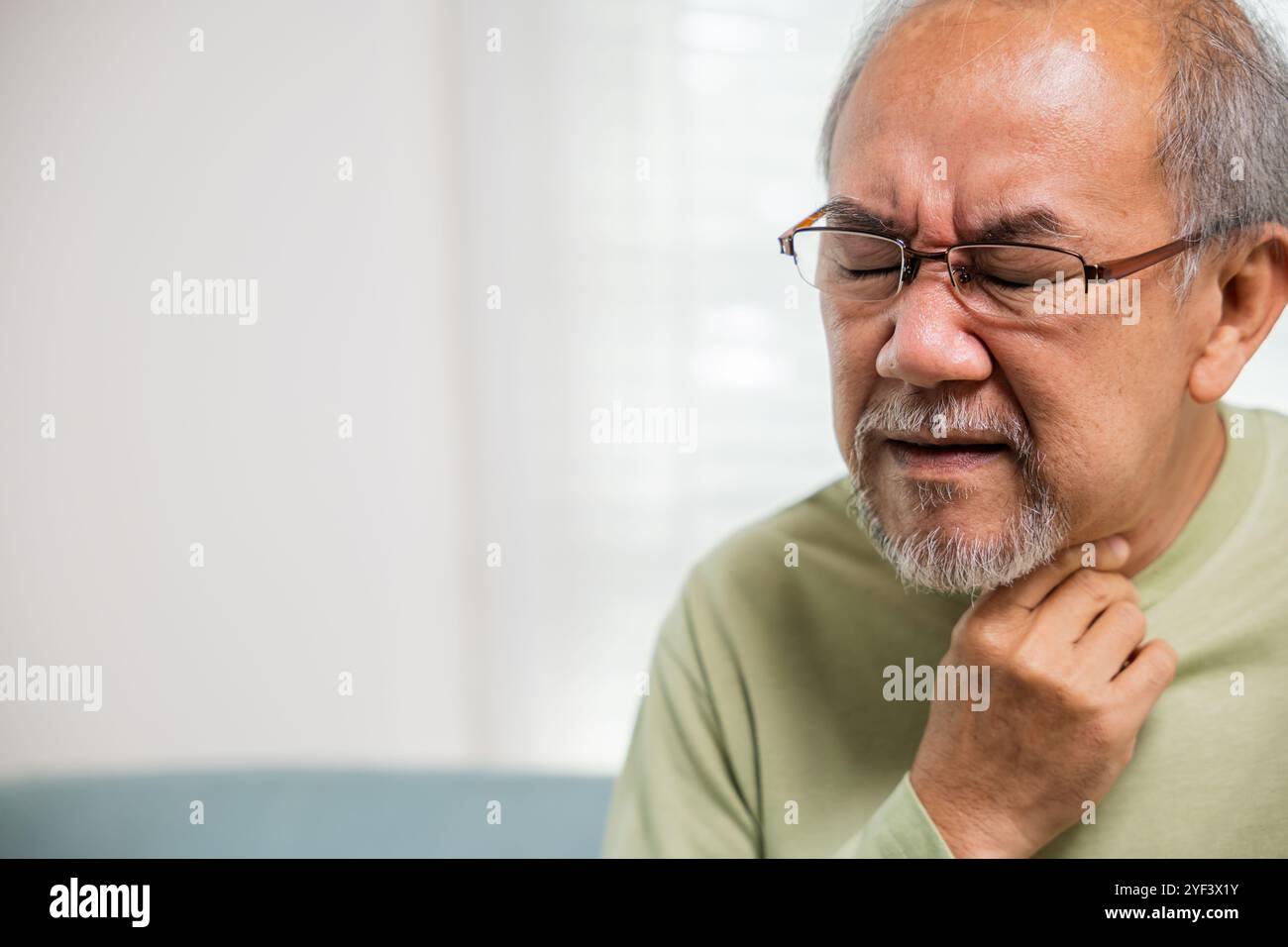 Retirement senior man feeling pain use hands holding neck and ...