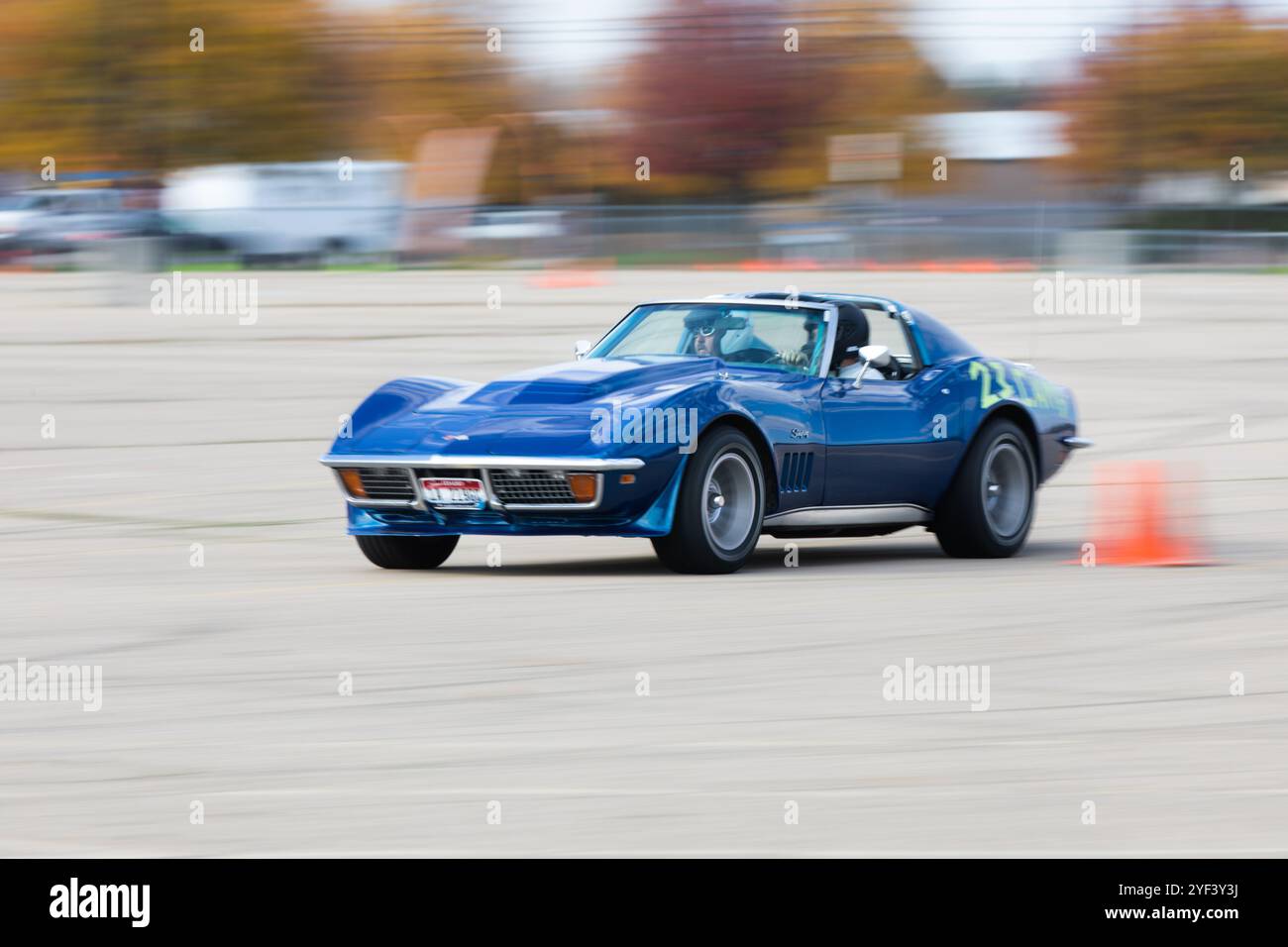 Classic Blue Corvette Racing on Track with Motion Blur Stock Photo - Alamy