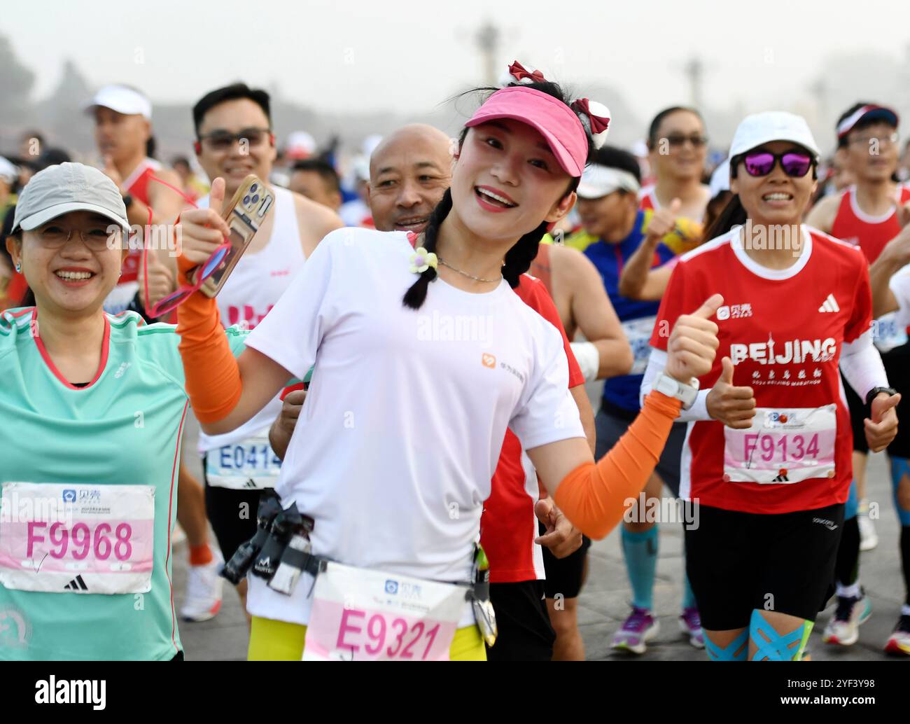 Beijing, China. 3rd Nov, 2024. Participants run along the Chang'an ...