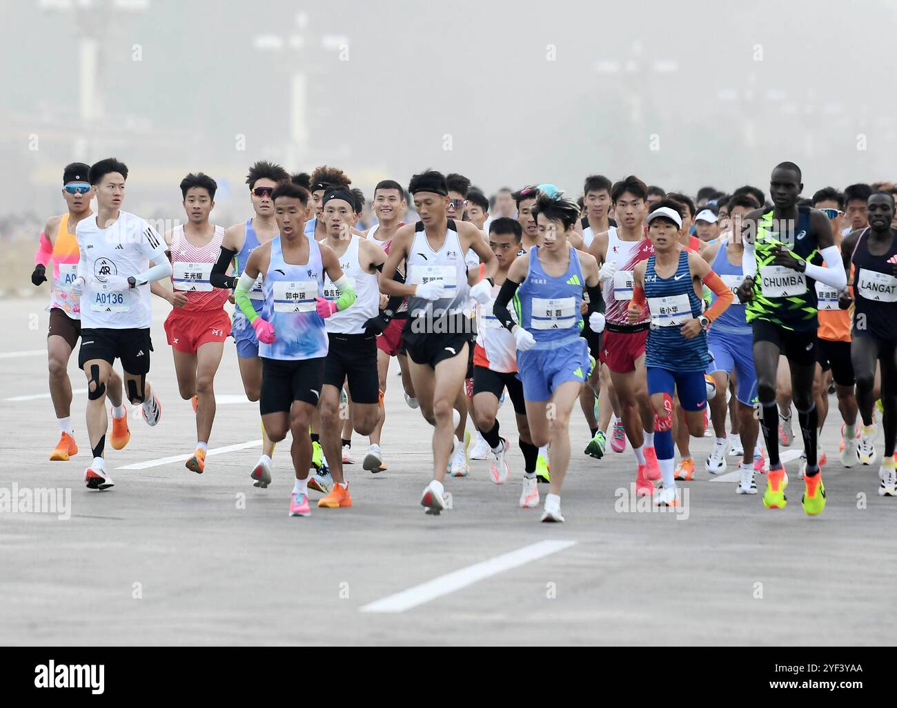 Beijing, China. 3rd Nov, 2024. Participants run along the Chang'an ...