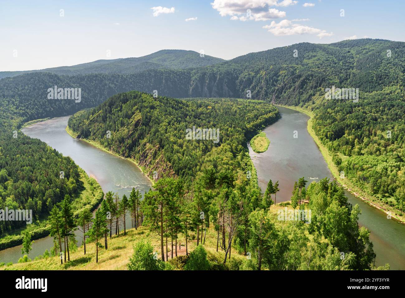 Awesome view of scenic river among evergreen woods Stock Photo - Alamy
