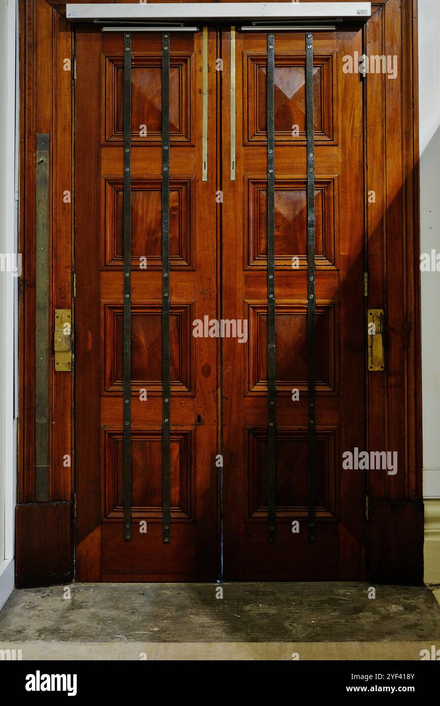 Red cedar entry doors The Australian Museum, crudely reinforced with ...