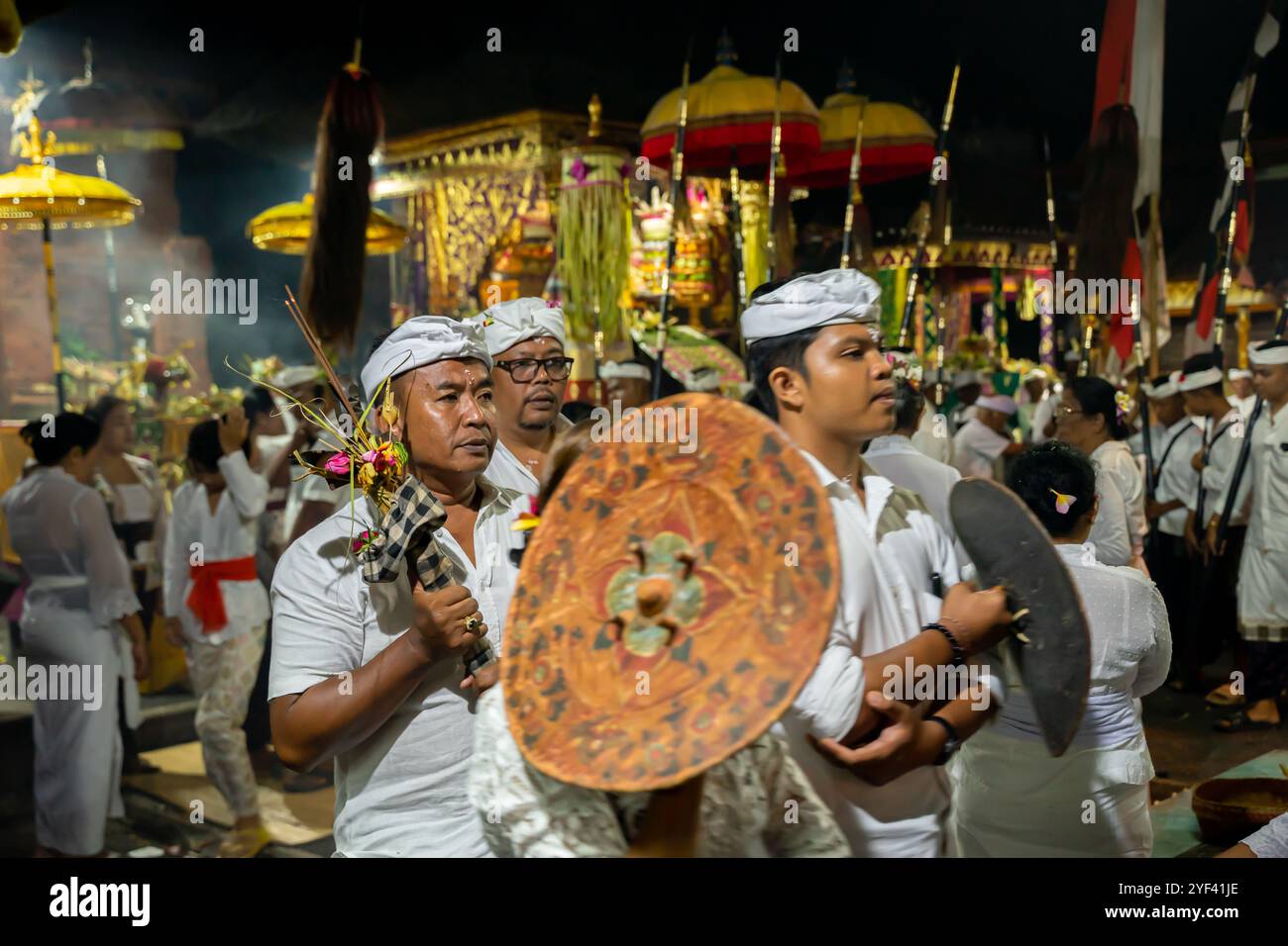 Priests parade with the Balinese shield at Kuningan ceremony, Pura ...