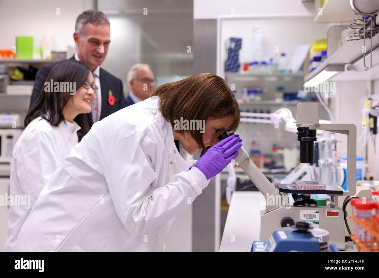 Chancellor of the Exchequer Rachel Reeves looks through a microscope ...