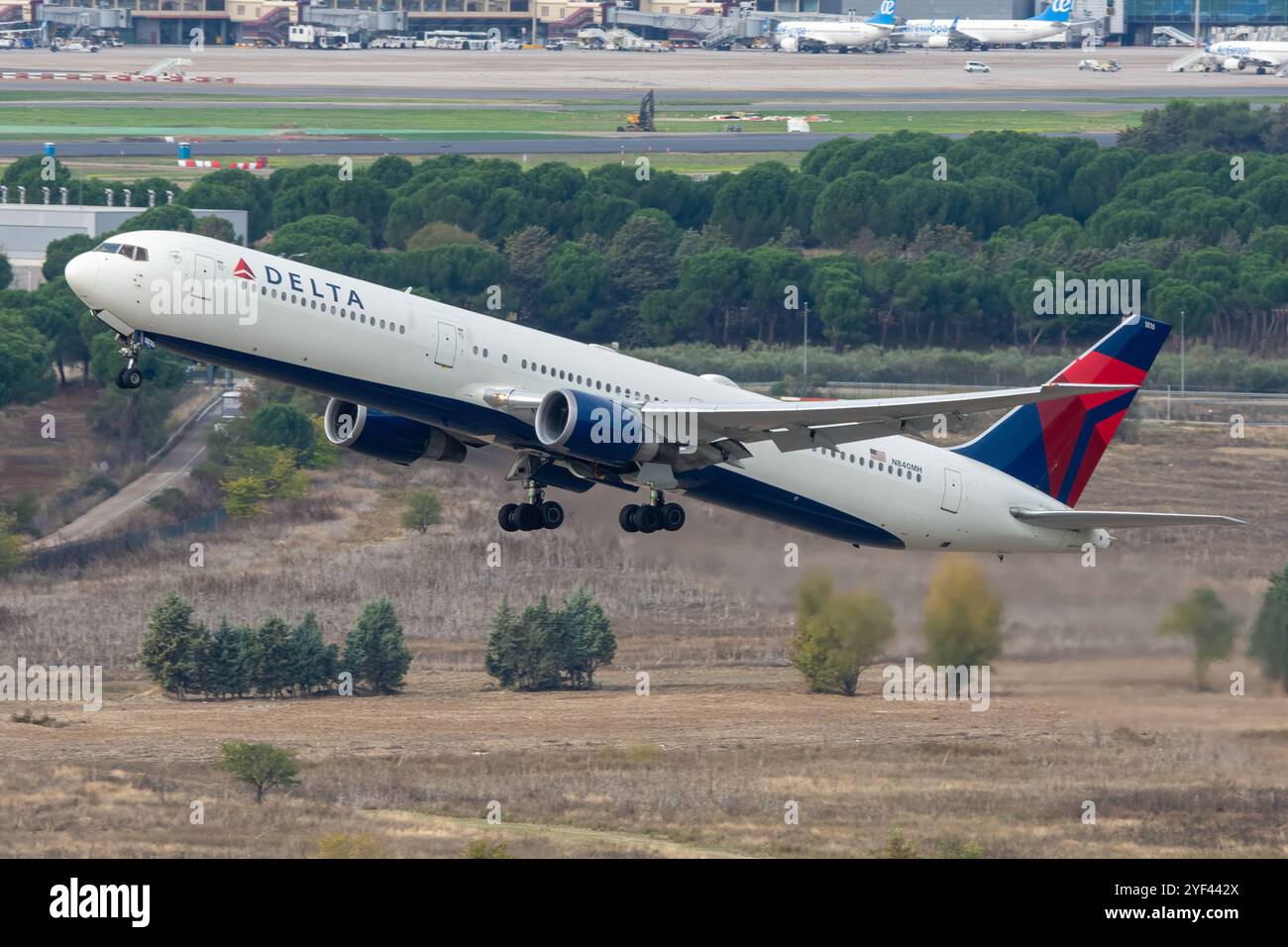 Madrid Barajas Airport. Delta Air Lines Boeing 767 airliner taking off ...